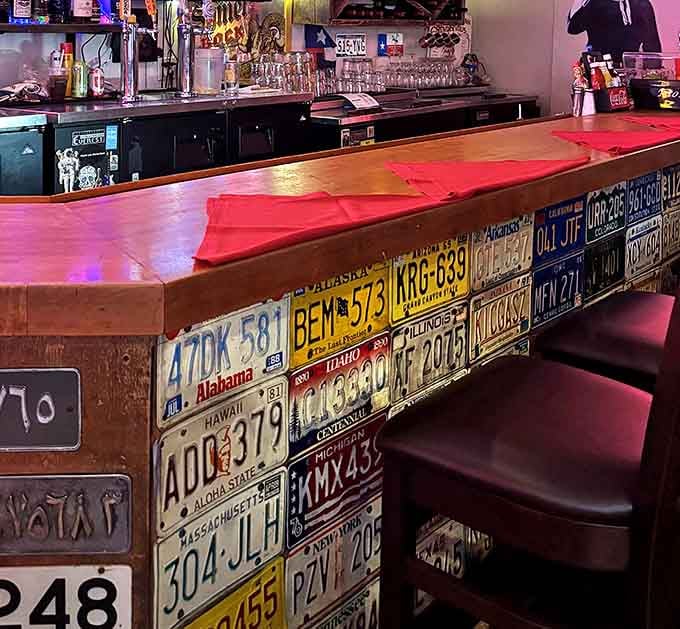The bar where license plates tell tales of travels far and wide. Each one represents a journey that wisely ended at this temple of Texas cuisine.