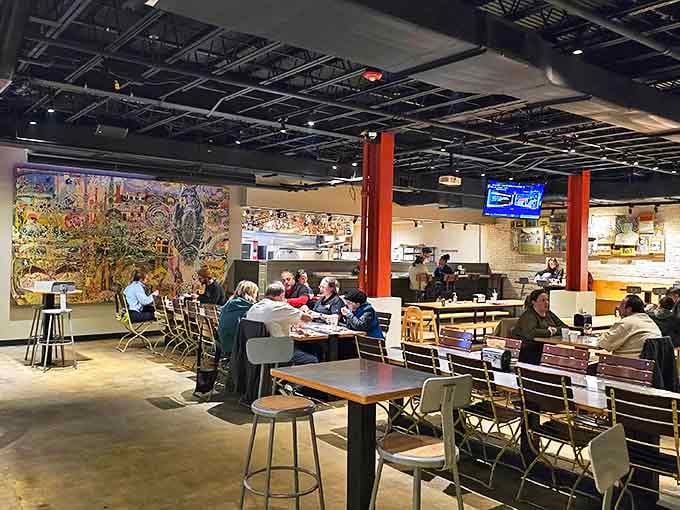 Colorful murals and communal tables create a space where pizza isn't just a meal &ndash; it's a community experience.