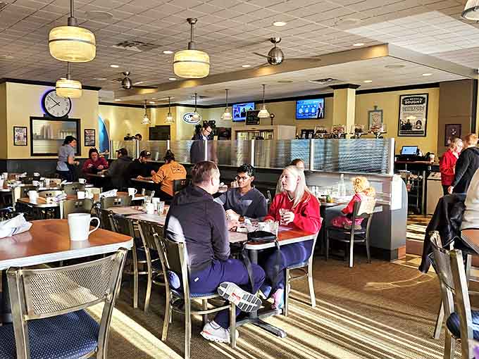 Weekend warriors plotting their day over steaming mugs of coffee. The real Milwaukee strategic planning happens over hash browns and hollandaise.