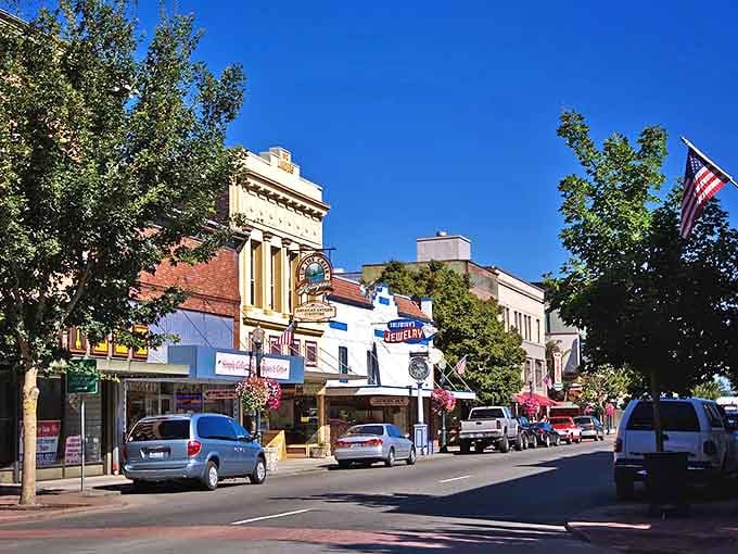 Downtown Centralia's storefronts bask in Pacific Northwest sunshine, their awnings and American flags creating a scene Norman Rockwell would have loved to paint.