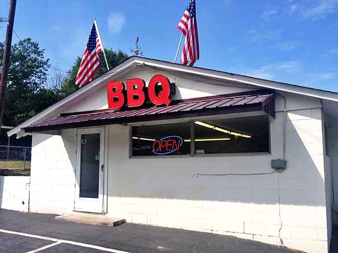 American flags and bold red BBQ letters—this isn't just a restaurant, it's a monument to doing things the right way, the traditional way.