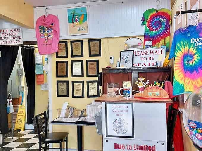 The entrance area tells the story&mdash;awards on the wall, tie-dye merch for sale, and a clear message: wait to be seated, it's worth it.