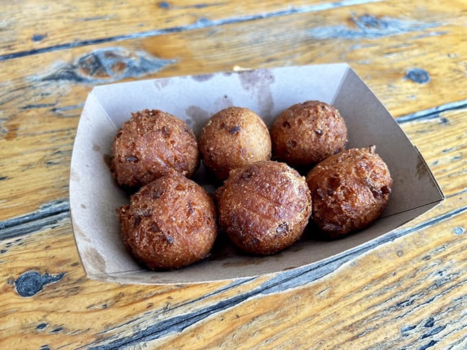 Hush puppies: golden-brown orbs of cornmeal joy that somehow manage to be both crispy and tender. Resistance is futile.