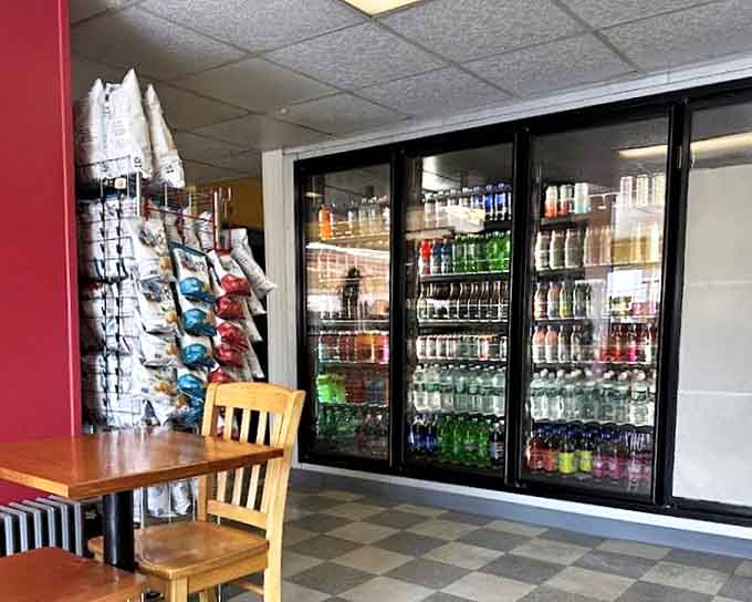 The beverage cooler stands ready to provide the perfect liquid companion to your sandwich adventure. Choose wisely, my friends.