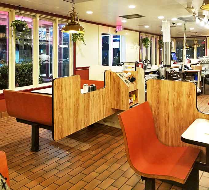 The evening light streams through windows illuminating booths where strangers become regulars and regulars become family.