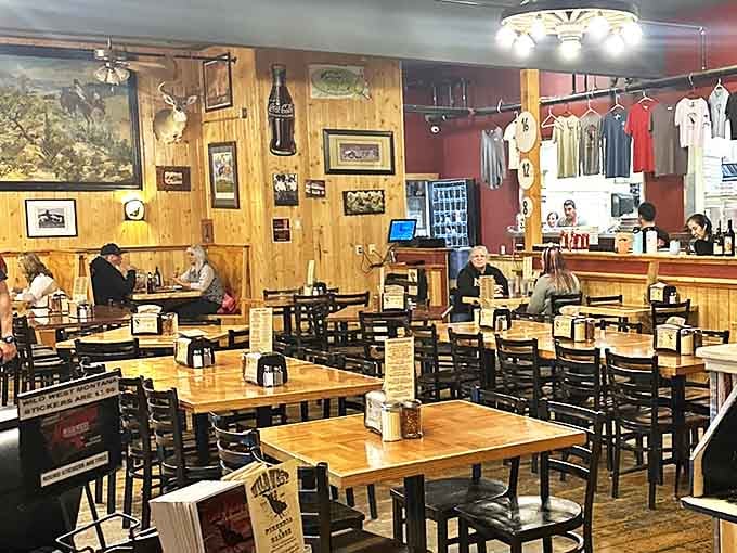 The dining room balances rustic charm with practical comfort, where wooden tables await their starring role in your personal pizza pageant.