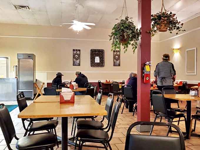 Hanging plants and burgundy accents create that "come as you are" atmosphere where both overalls and business suits feel equally at home.