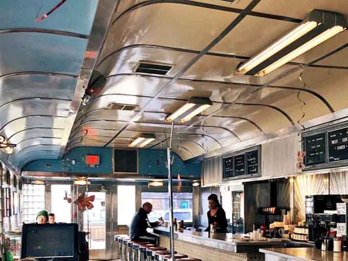 The curved ceiling and blue walls create a cocoon of comfort where calories don't count and coffee refills appear like magic from friendly wizards.