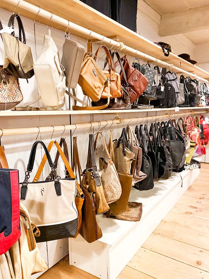 Handbag heaven! Designer and everyday purses hanging like ripe fruit, ready to be plucked by savvy shoppers.