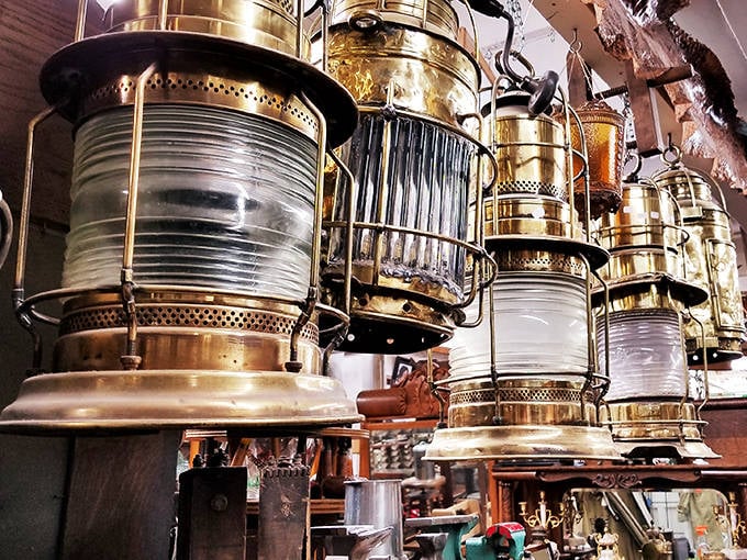 Maritime history hangs from the ceiling in these brass lanterns that once guided ships through Alaskan waters, now illuminating collectors' hearts.