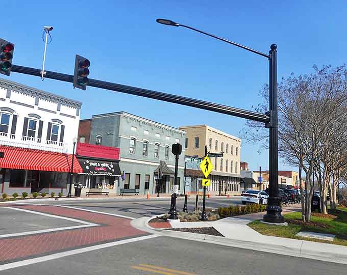 These colorful storefronts with their brick sidewalks could teach modern developers a thing or two about creating walkable charm.