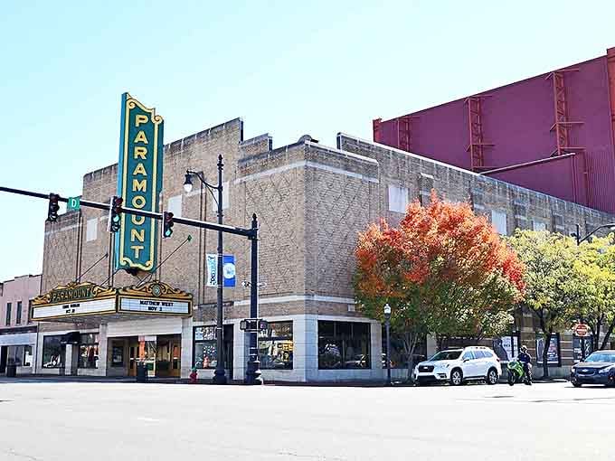 The Paramount Arts Center stands proudly on the corner, its vertical sign a historic exclamation point in downtown Ashland's architectural sentence.