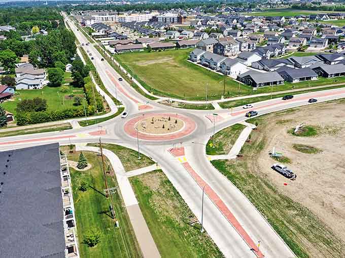 Modern neighborhoods feature roundabouts and green spaces, where suburban living doesn't require sacrificing your entire Saturday to lawn maintenance.