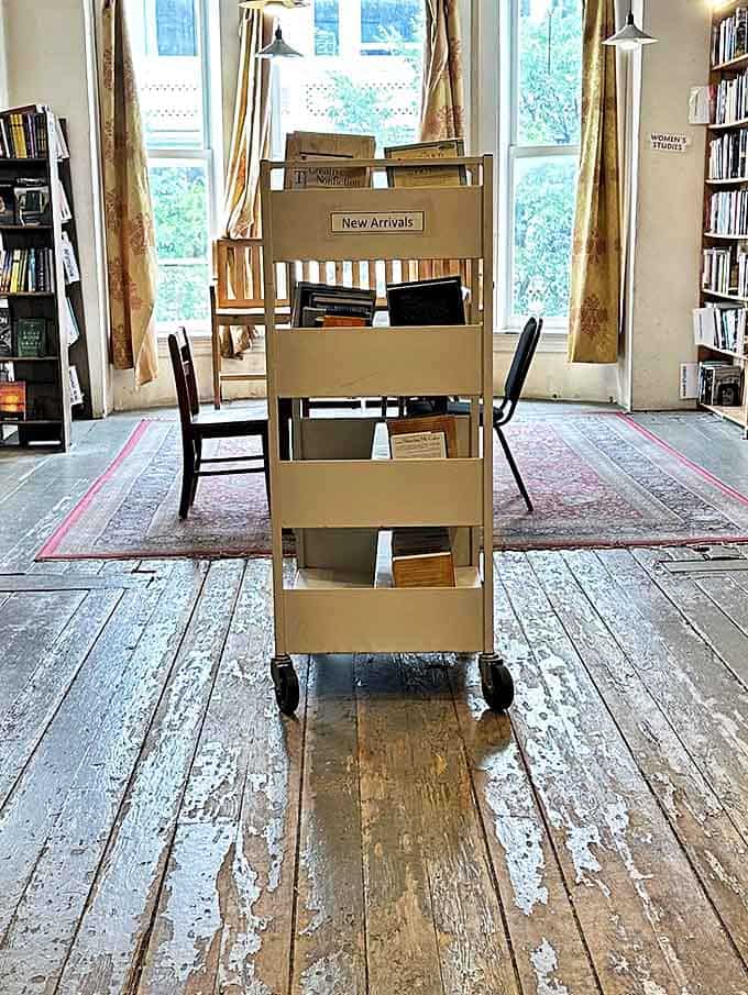 The "New Arrivals" cart &ndash; a mobile feast of possibilities rolling through worn wooden floors that have supported countless literary pilgrimages.