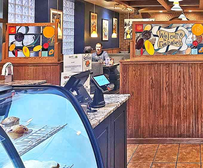 Behind the counter where breakfast dreams come true. Those colorful stained glass panels add a touch of whimsy to your morning ritual.