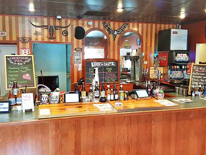 Behind this counter, BBQ magic happens daily. The neon sign isn't just decoration—it's a promise being kept.