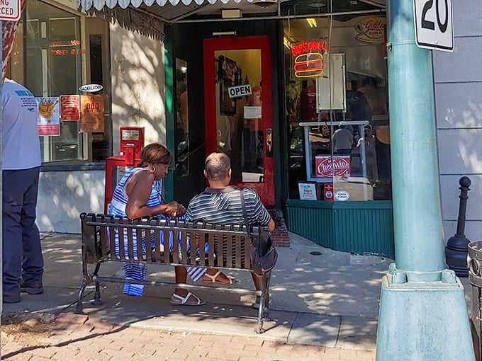 The sidewalk bench: Hap's unofficial dining room where strangers become friends over shared burger appreciation.