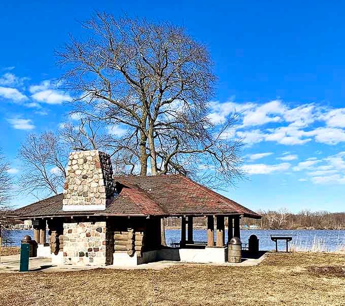 Stone fireplace meets timber craftsmanship in this CCC-era pavilion &ndash; where countless family reunions have survived both summer downpours and awkward conversations.