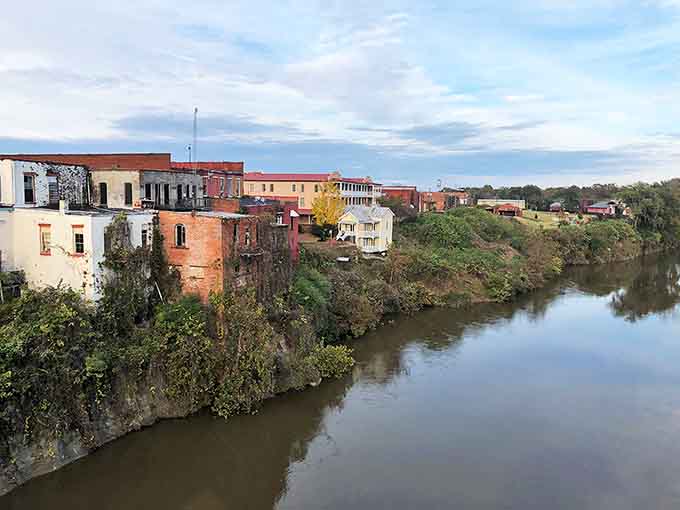 Riverside buildings cling to the bluff like colorful barnacles on history's hull. The view hasn't changed much in a century.
