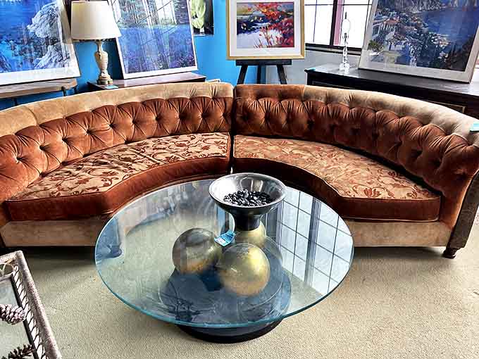 This curved velvet sectional has hosted countless conversations in its previous life and stands ready for your next gathering of friends.