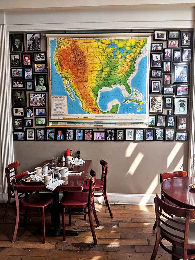 A map of America surrounded by family photos tells you everything: this place understands that food, travel, and family are life's greatest treasures.