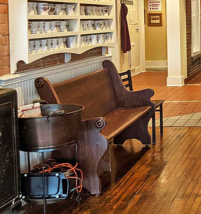 This vintage church pew in the waiting area has witnessed countless conversations between strangers who become temporary breakfast buddies.