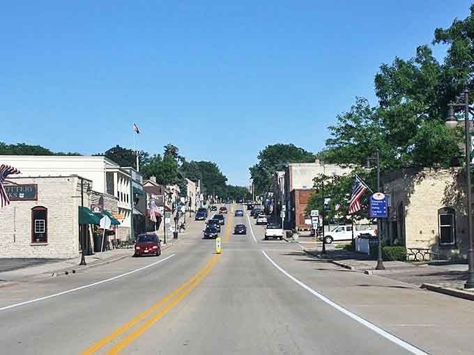 Main Street America lives on in Cambridge, where locally-owned shops and American flags create a timeless scene.
