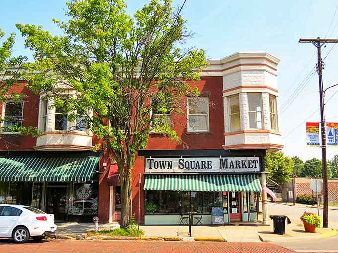 The Town Square Market beckons with striped awnings&mdash;proof that corner stores still thrive when communities support their local treasures.