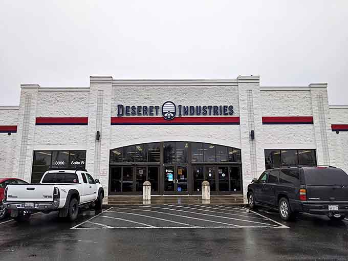 Rain can't dampen the thrill of the hunt at Deseret Industries, where organized aisles await under that distinctive beehive logo.