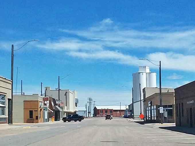 Wide streets and grain elevators tell the story of agricultural America where honest work still means something real.