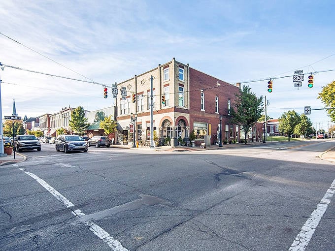 The heart of Huntingburg comes alive at this busy intersection where historic buildings meet modern convenience in perfect harmony.