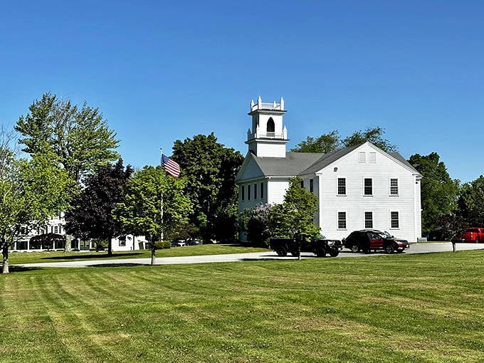 New London's town green features a classic white church with bell tower, embodying the quintessential New England charm that attracts retirees.