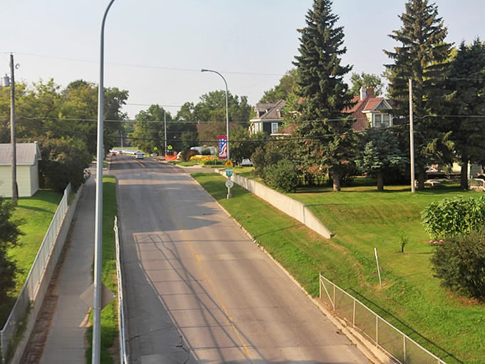 Tree-lined residential streets in Rugby offer peaceful neighborhoods where neighbors know each other and housing costs remain affordable.
