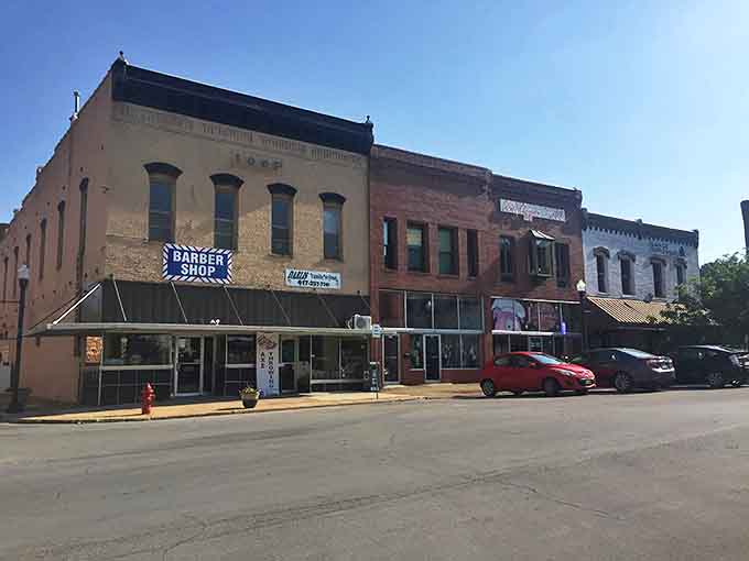Historic brick buildings line West Plains' downtown district, where local businesses thrive in beautifully preserved architecture from a bygone era.