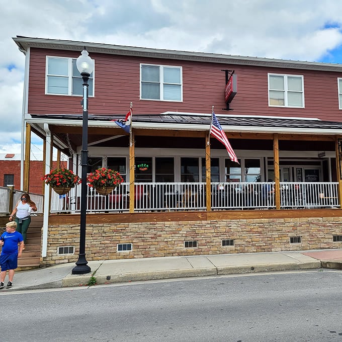 Front porch philosophy happens daily at this charming eatery, where American flags flutter above conversations that solve most of the world's problems by dessert.