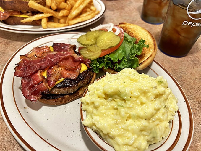 A burger that demands a two-handed commitment, crowned with bacon and cheese. The side of mac and cheese isn't diet-friendly, but your soul will thank you.
