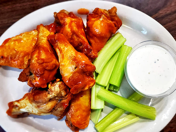 Buffalo wings done right&mdash;saucy but not swimming, with crisp celery standing by like a loyal sidekick ready for the heat.
