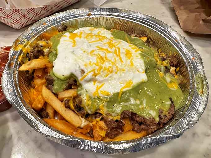 Carne asada fries: the diplomatic summit where Mexican flavors and American comfort food sign a delicious peace treaty on a bed of french fries.