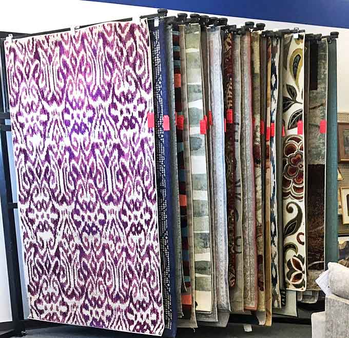 Textile treasures in every pattern imaginable. That purple ikat print is practically begging to transform someone's living room.
