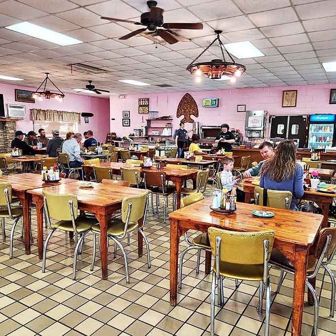 Families gathering around wooden tables&mdash;the timeless ritual of breaking bread together remains unchanged in this pink-walled sanctuary.