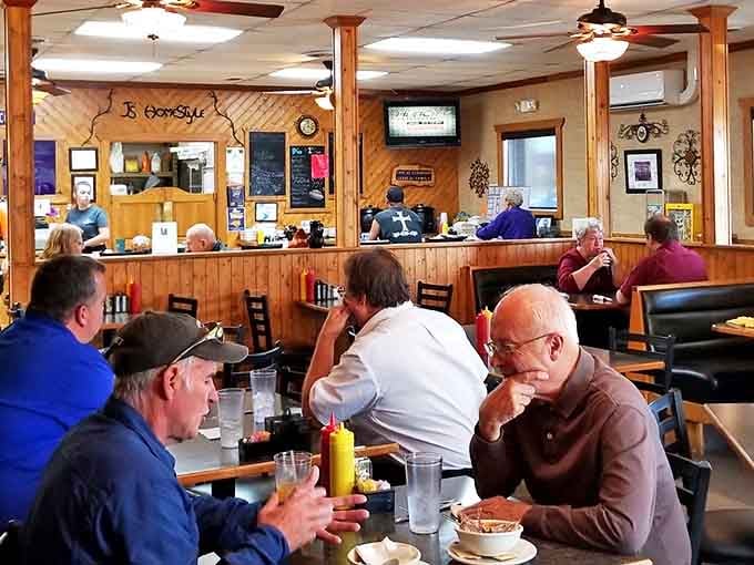 Morning philosophers solving world problems over eggs and coffee. These booths have hosted more honest conversations than most therapists' offices.
