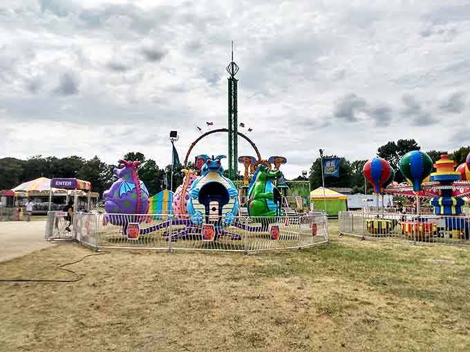 The fairgrounds await their annual transformation from quiet field to vibrant community celebration where funnel cakes become a legitimate food group.
