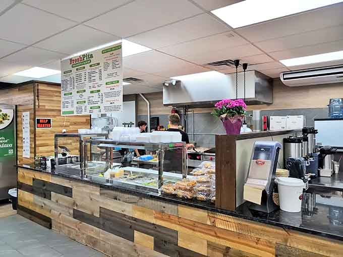 Fresh Pita's rustic wooden counter promises homemade goodness without pretension &ndash; comfort food that doesn't need a filter to look appetizing.