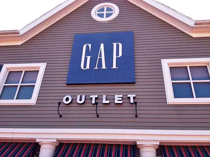The GAP Outlet sign stands proud against the New England-inspired architecture. Those blue letters have been responsible for more "just one more t-shirt" decisions than anyone cares to admit.