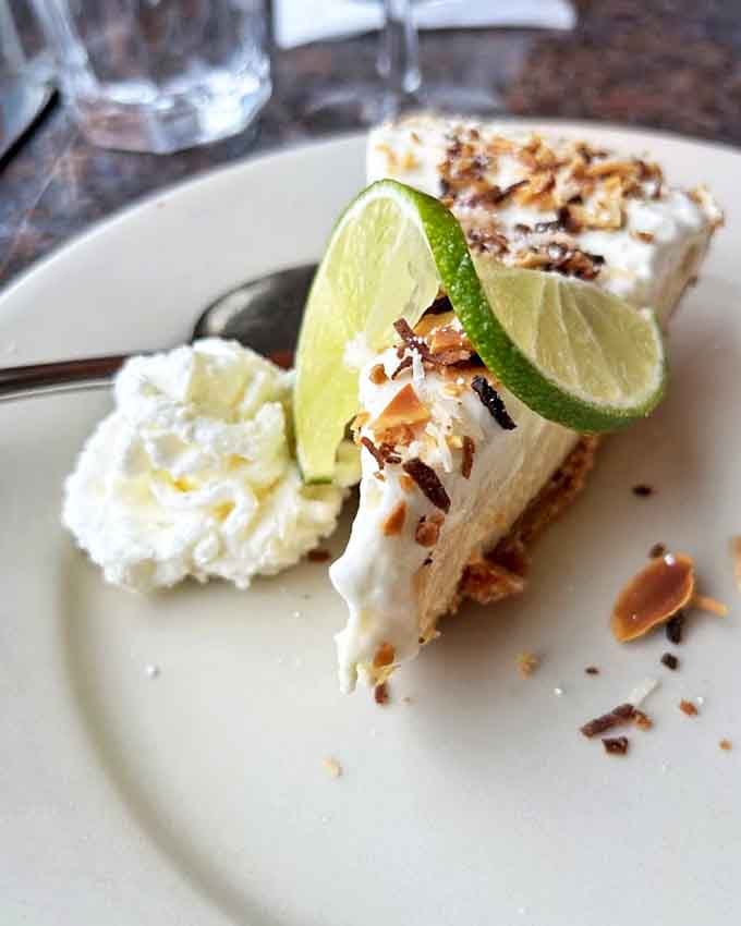 Key lime pie that strikes the perfect balance between tart and sweet, with a dollop of whipped cream playing Switzerland.