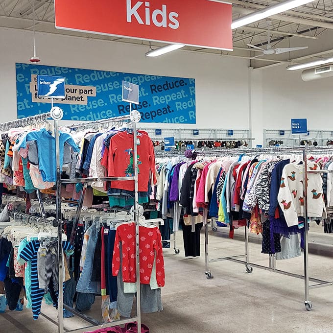 The kids' section: where growth spurts meet budget-friendly solutions. That "Reduce, Reuse, Repeat" sign isn't just decoration—it's a lifestyle manifesto.