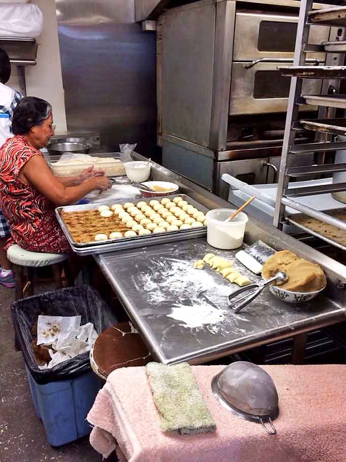 Behind the scenes, pastries take shape under skilled hands. Culinary magic happens when tradition meets dedication in the kitchen.