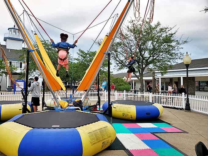 The bungee jumping attraction gives kids a taste of adventure while parents experience the thrill of finding designer labels at outlet prices.
