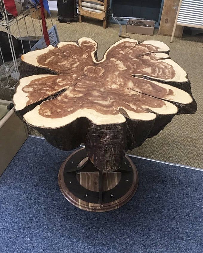 Mother Nature collaborated with a craftsman to create this stunning tree-slice table, bringing the Black Hills right into your living room.