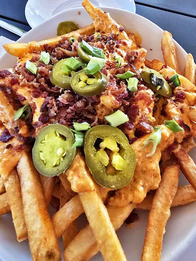 Behold the legendary loaded pimento cheese fries in all their glory! Jalape&ntilde;os and bacon join the party like unexpected but entirely welcome guests at Thanksgiving dinner.